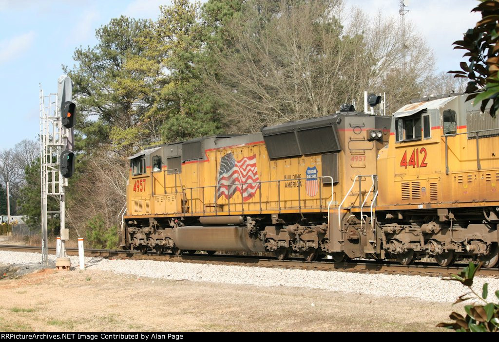 UP SD70Ms 4957, 4412, and 5098 head east past the Dofson Road signals